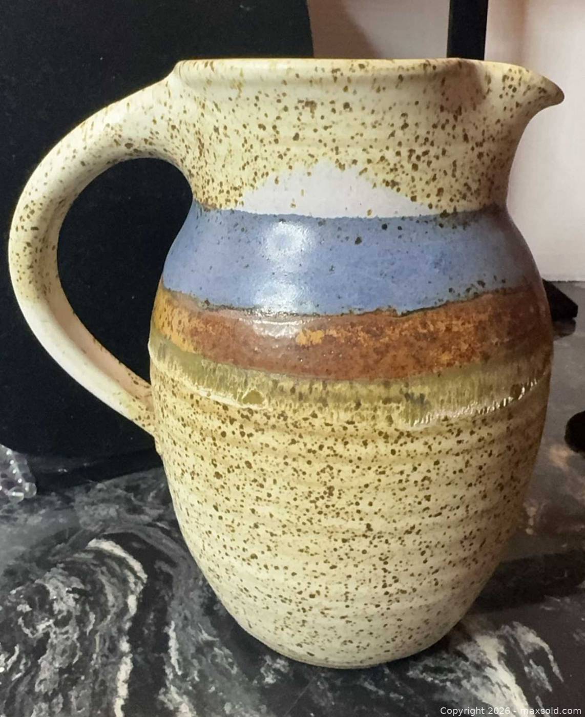 Speckled cream glazed stoneware pitcher | Maxsold