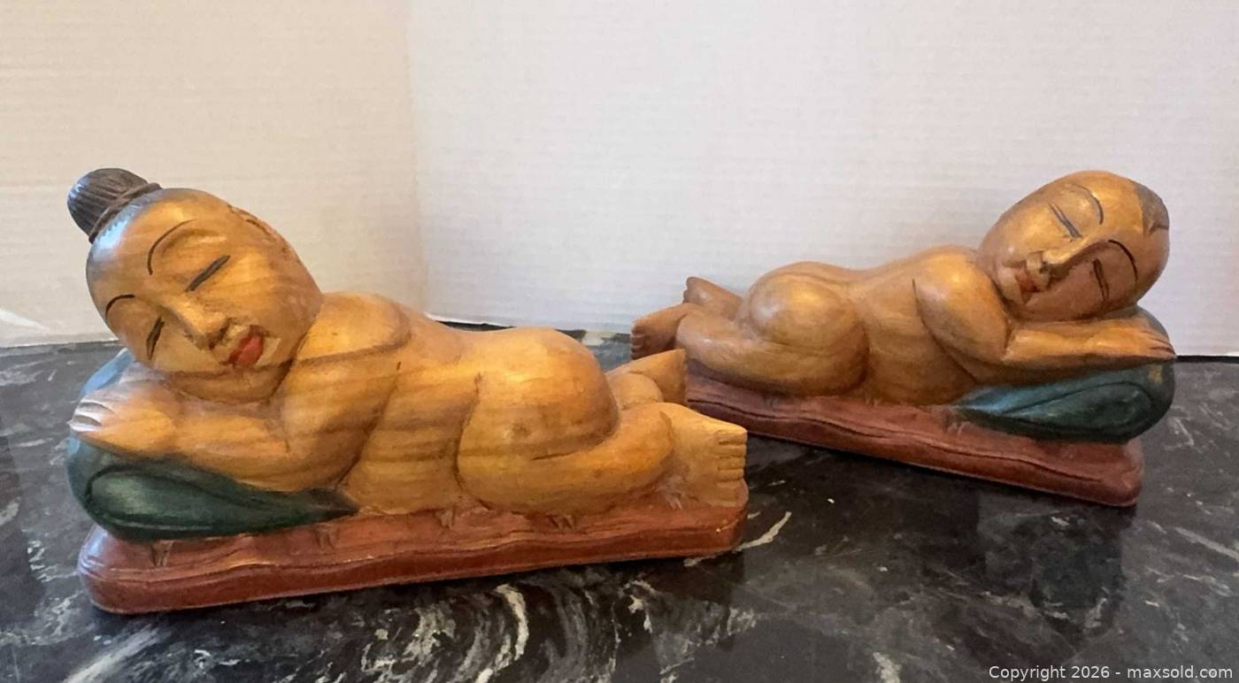 Pair reclining carved wood Asian figures | Maxsold