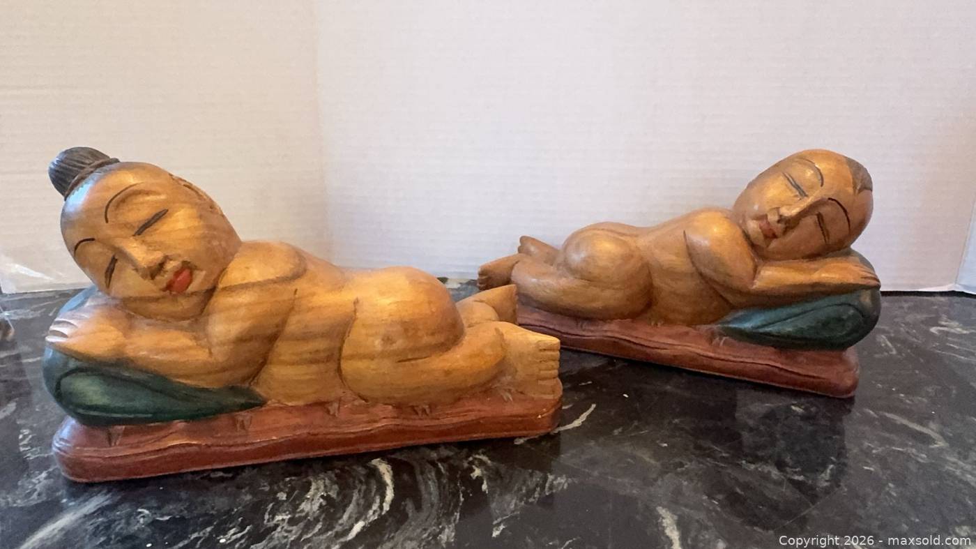 Pair reclining carved wood Asian figures | Maxsold