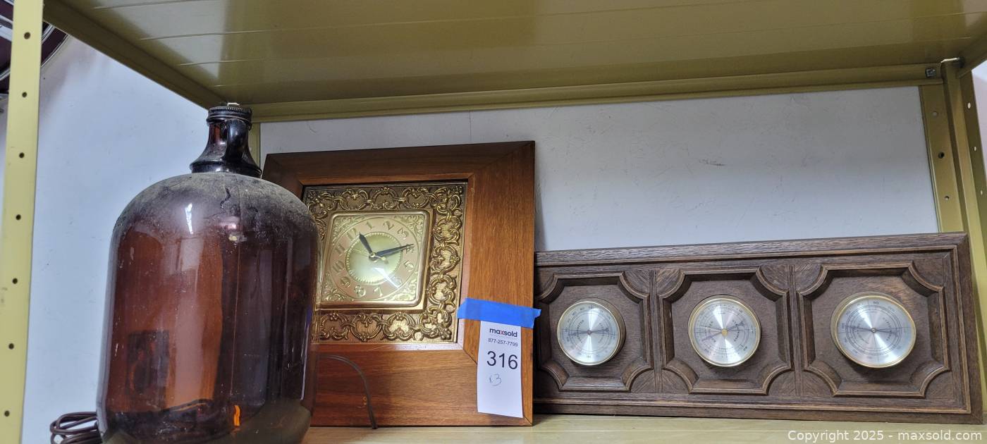 Amber glass jug, wooden wall clock, 3-dial weather station | Maxsold