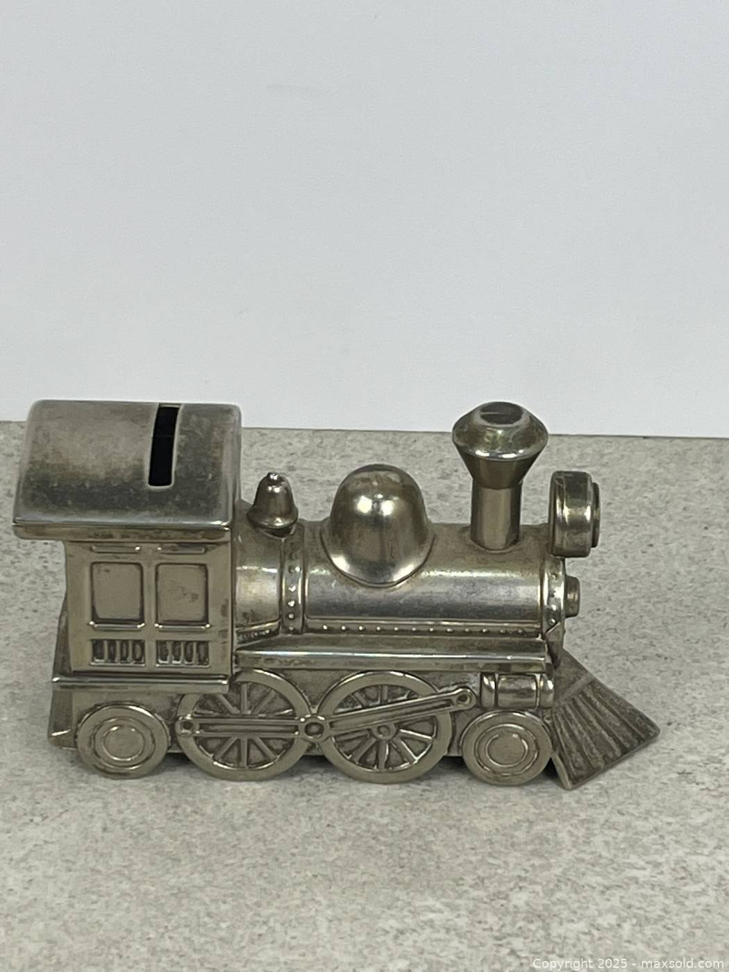 Elegance silver plated train coin bank | Maxsold