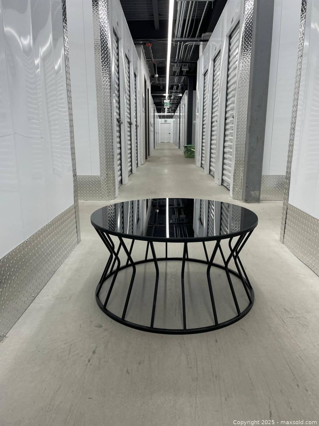 Round black glass coffee table | Maxsold