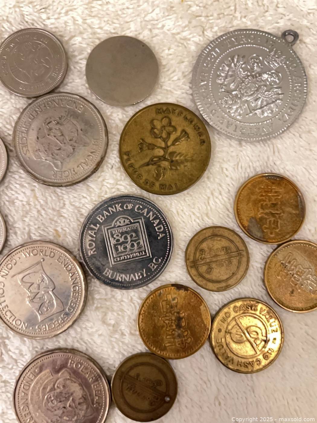 Assorted metal tokens and medallions | Maxsold