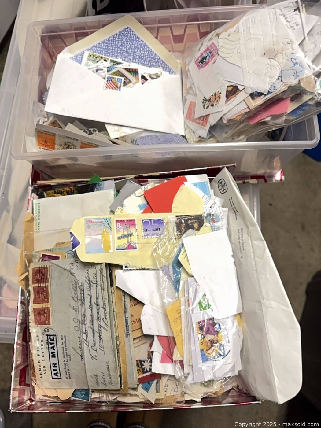 Two boxes of postage stamps and postcards | Maxsold