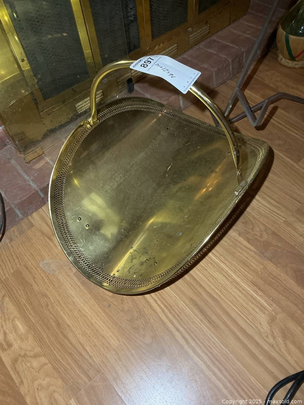 Brass log holder and wrought iron stand | Maxsold