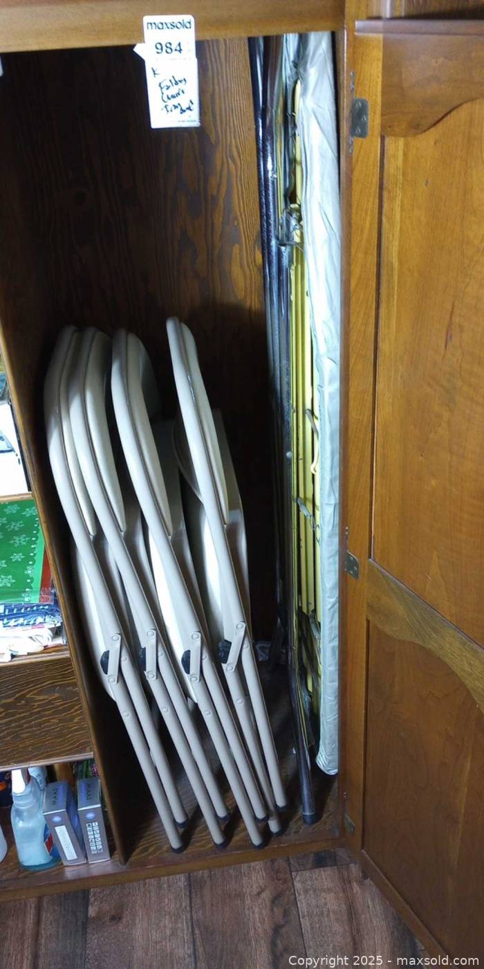 6 Folding Chairs, Ironing Board, Iron, Wooden Storage Cabinet | Maxsold