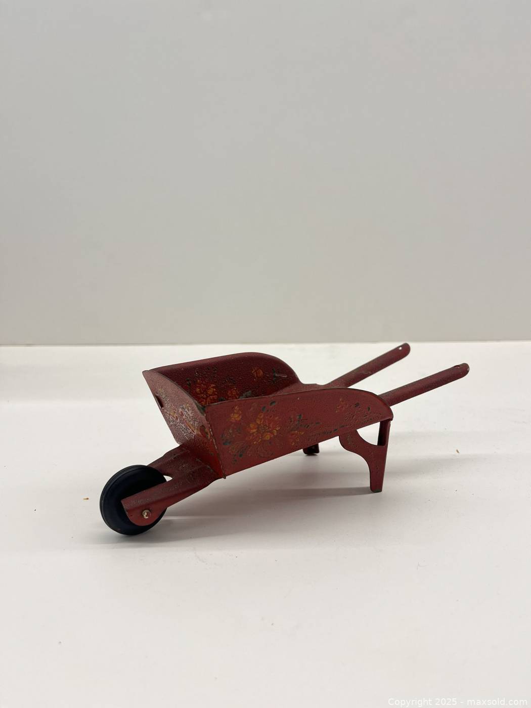 Antique miniature red metal wheelbarrow toy | Maxsold