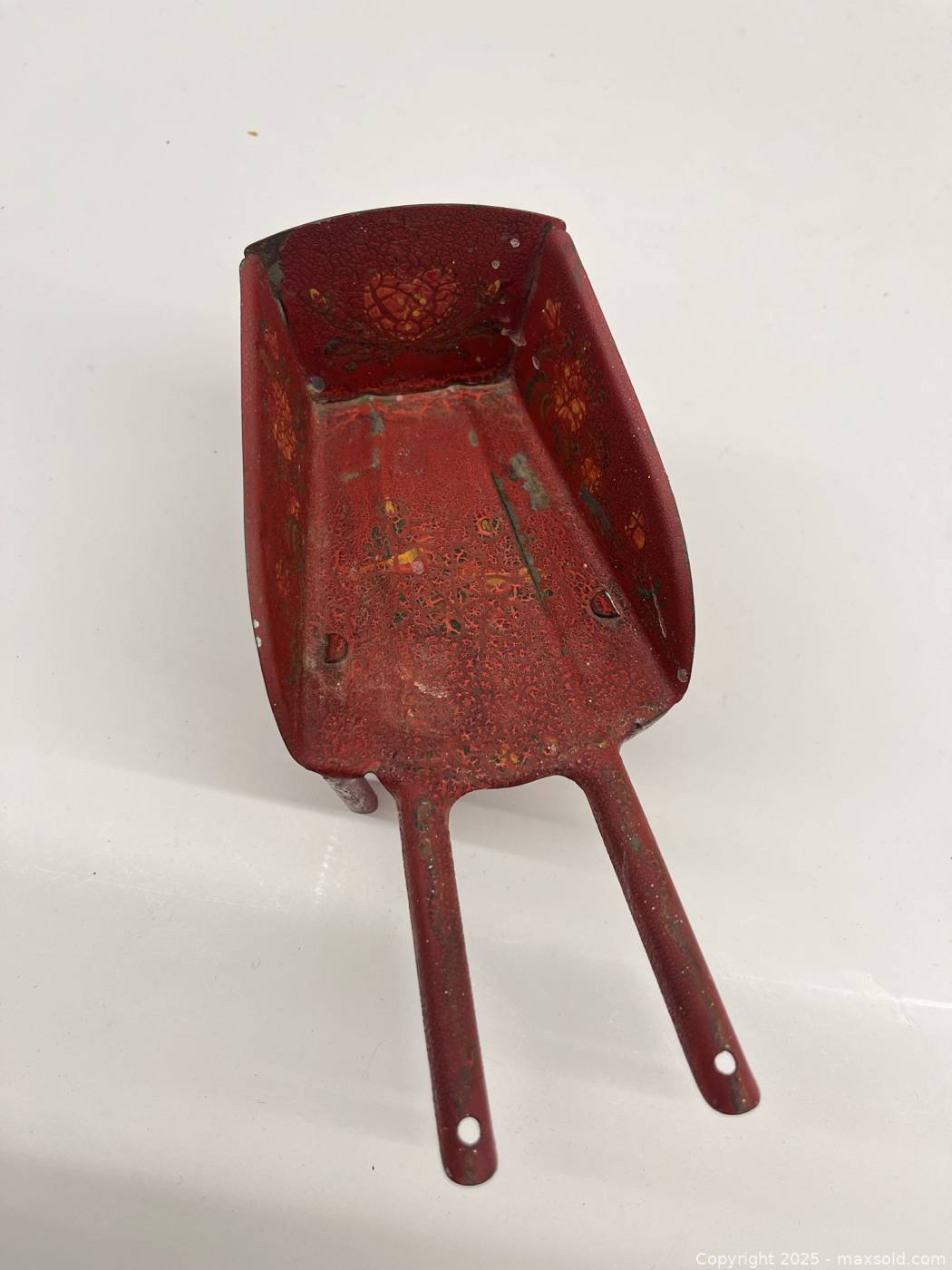 Antique miniature red metal wheelbarrow toy | Maxsold