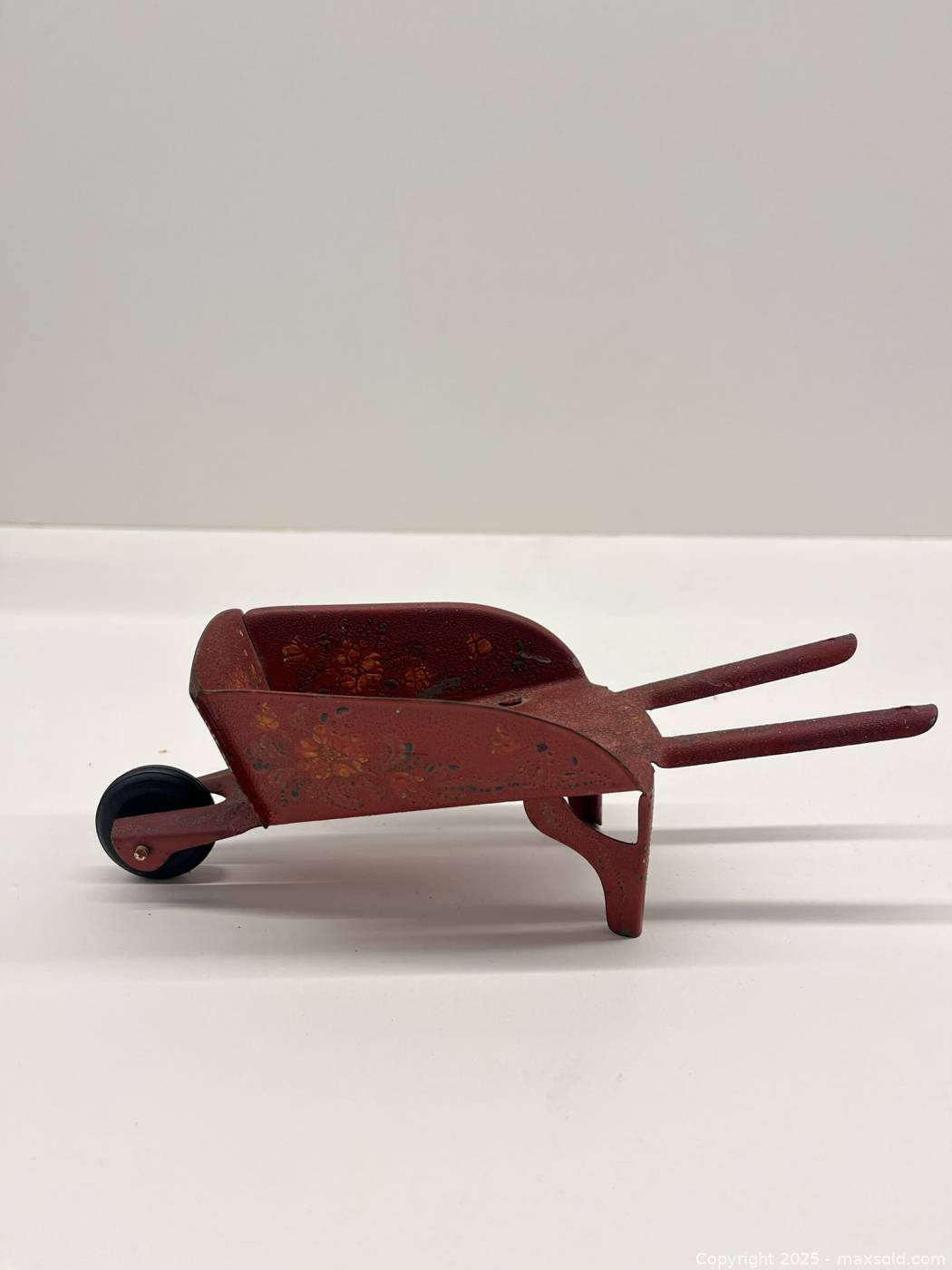 Antique miniature red metal wheelbarrow toy | Maxsold