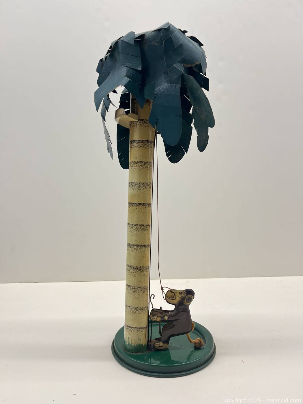 Vintage litho tin monkey climbing palm tree toy | Maxsold