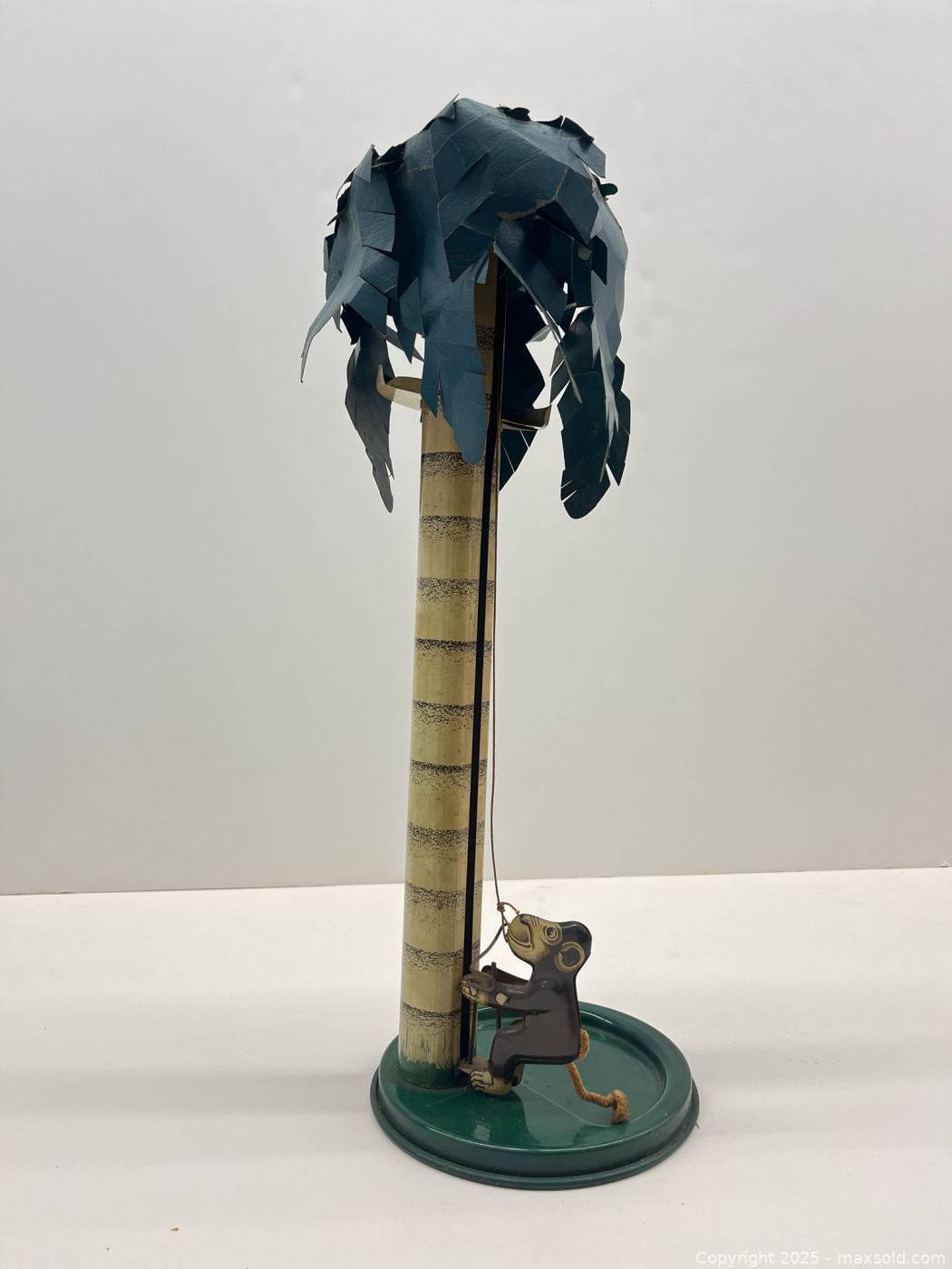 Vintage litho tin monkey climbing palm tree toy | Maxsold