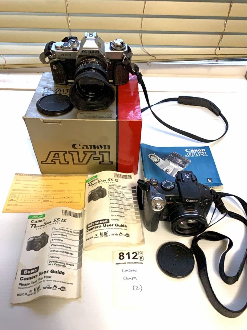 Canon AV-1 film camera and PowerShot S5 IS | Maxsold