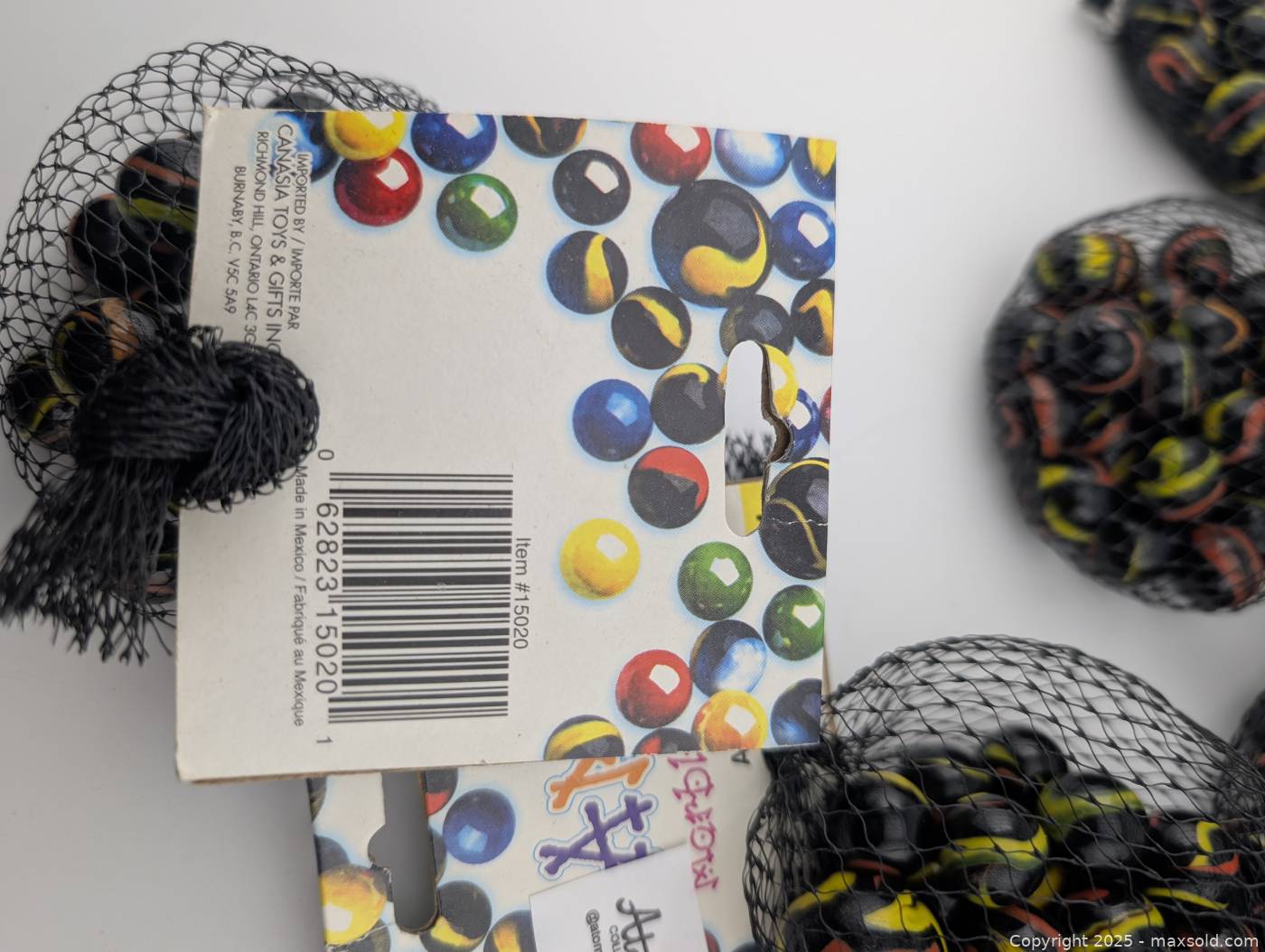 Six sealed Amigo marble net bags | Maxsold