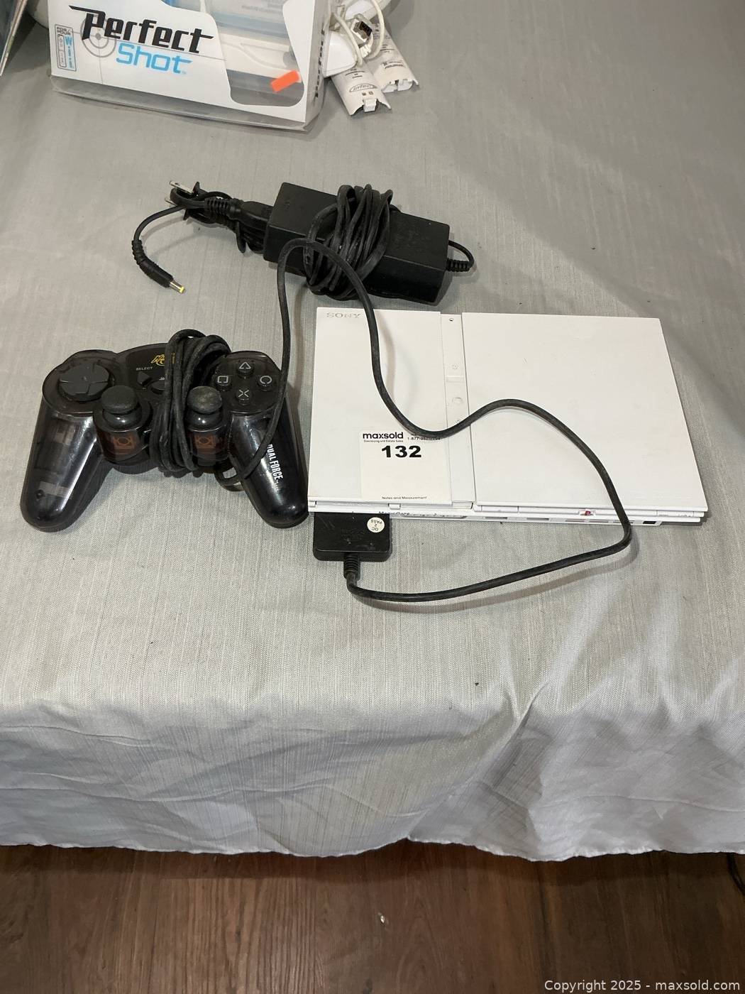 Sony PlayStation 2 Slim console with power adapter and controller | Maxsold