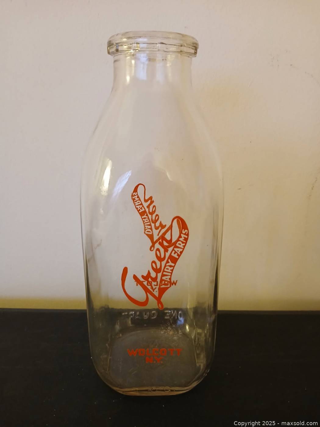 Green's Dairy Farms one-quart glass milk bottle | Maxsold