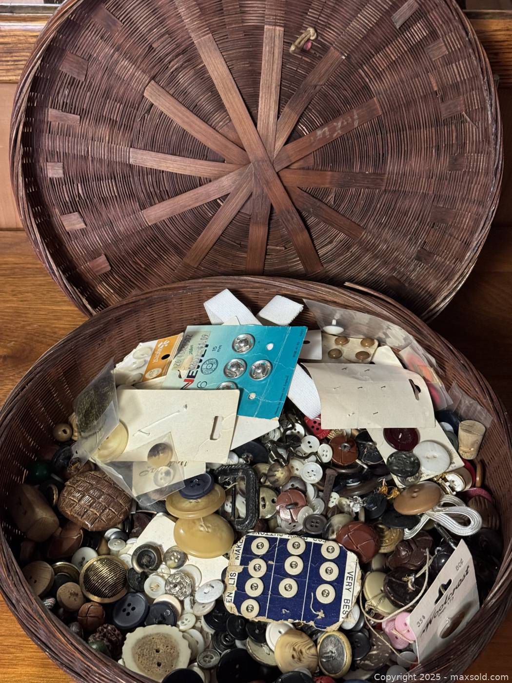 Wicker basket with assorted buttons and sewing notions | Maxsold