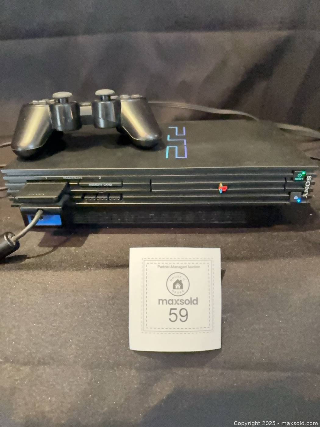 Sony PlayStation 2 console with wired controller | Maxsold