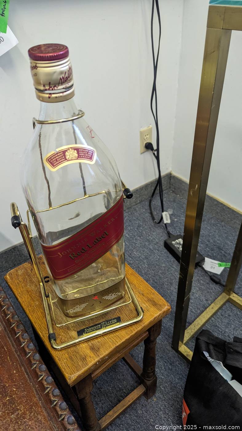 Johnnie Walker Red Label 4.5-L bottle with gold swing stand | Maxsold