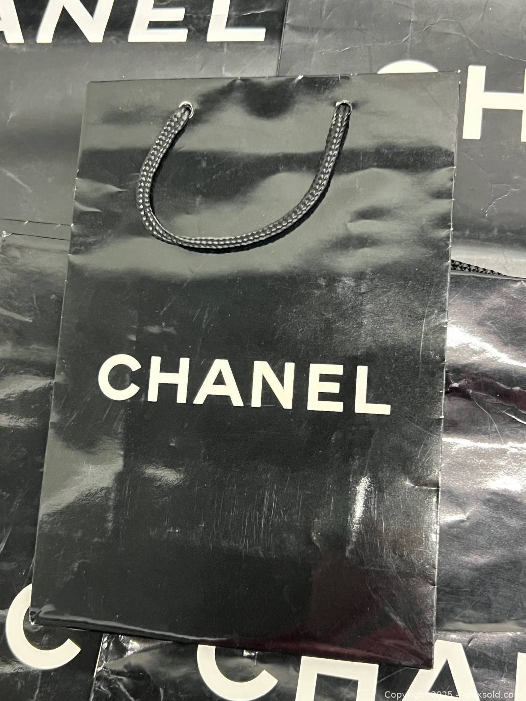 Chanel black and white paper shopping bags collection | Maxsold