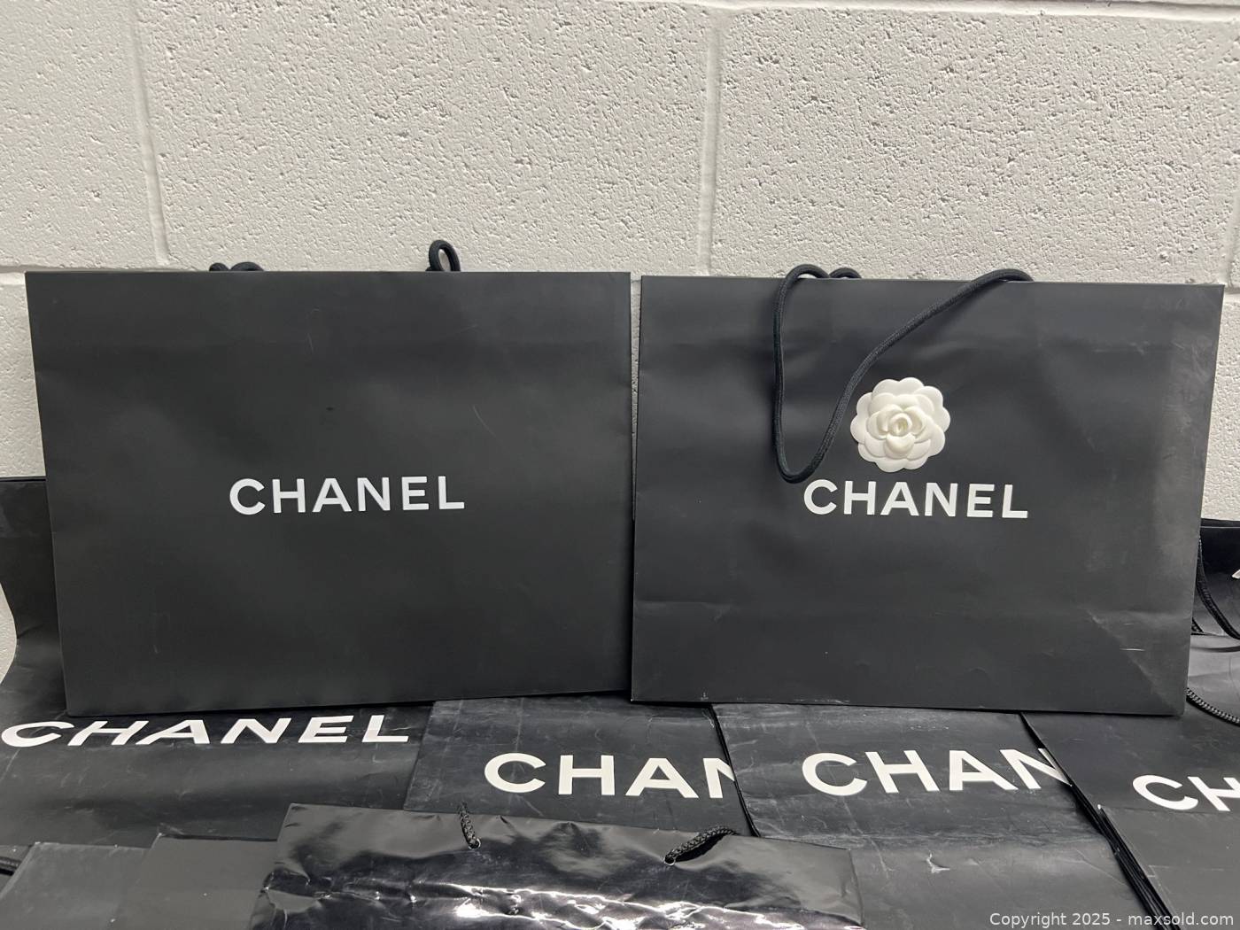 Chanel black and white paper shopping bags collection | Maxsold