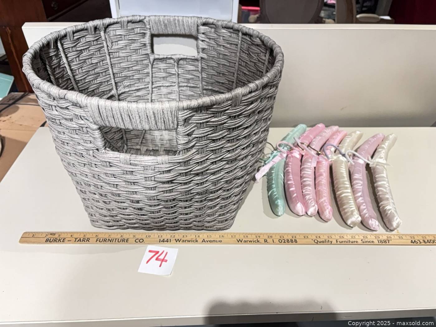 Decorative woven storage basket and 7 padded hangers | Maxsold