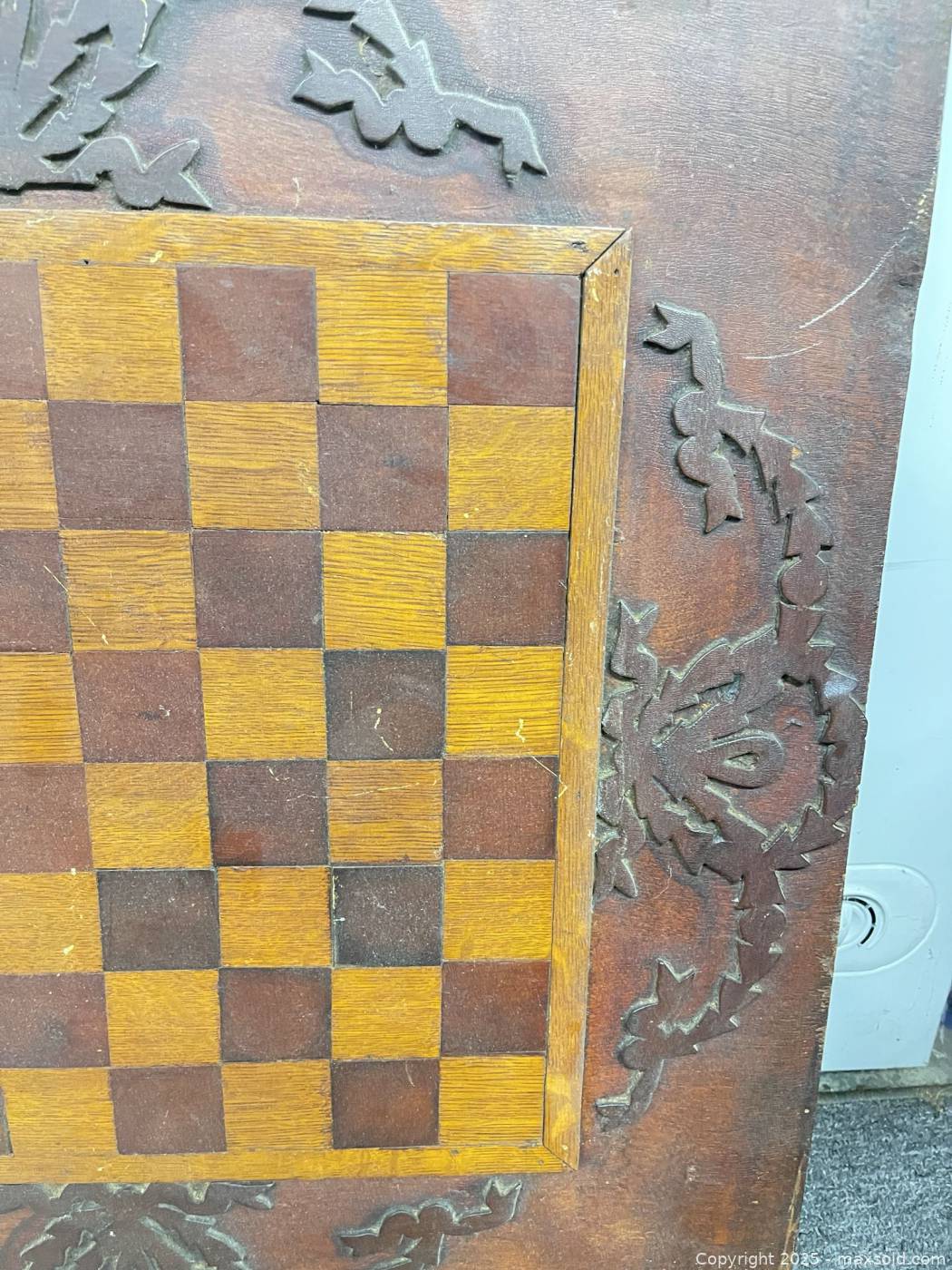 Vintage wooden checkers board with carved frame | Maxsold