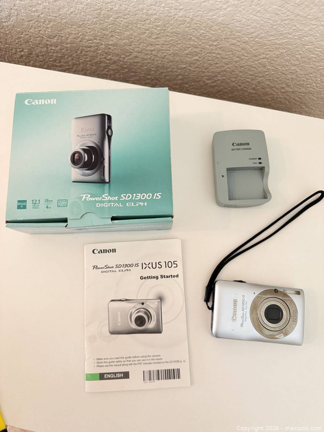 Canon PowerShot SD1300 IS Digital ELPH camera with charger, manual ...