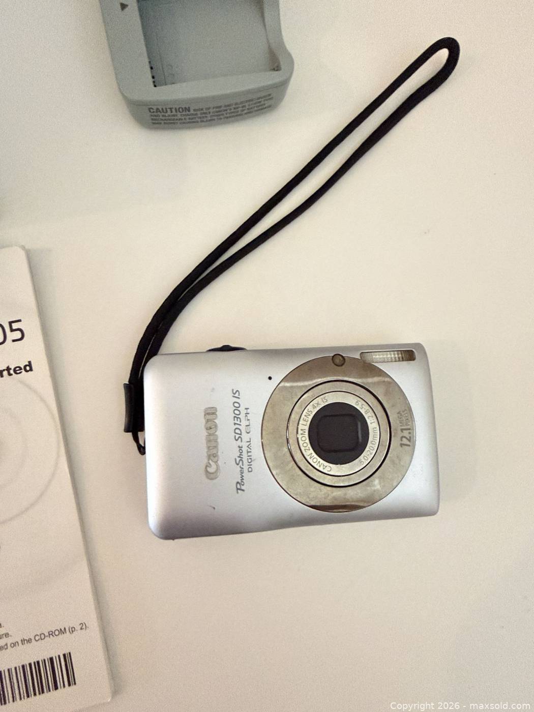 Canon PowerShot SD1300 IS Digital ELPH camera with charger, manual ...