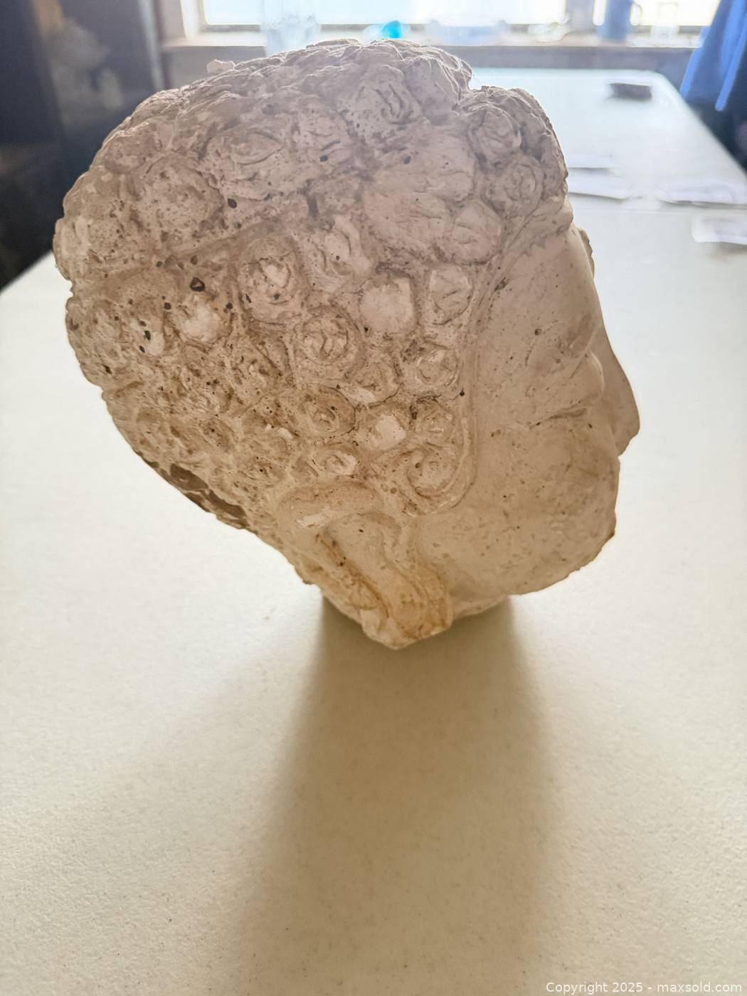 Plaster Buddha head sculpture | Maxsold
