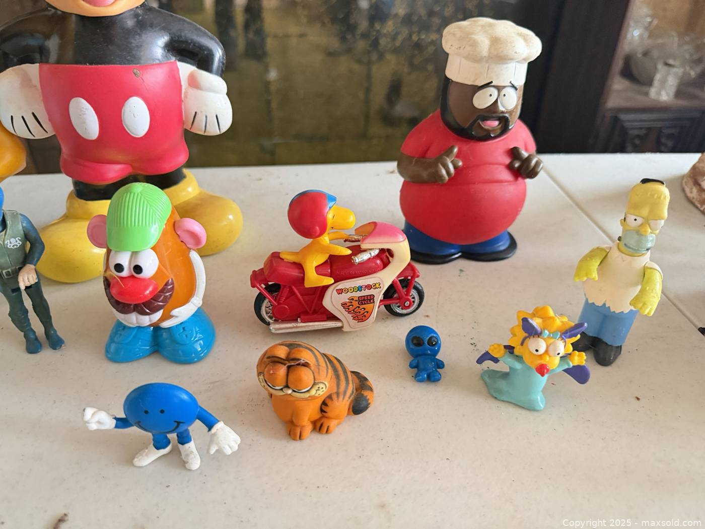 Lot of 12 Small Toy Figures — Simpsons, Garfield, Mickey | Maxsold