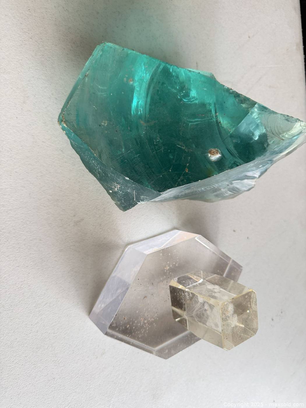 Aqua slag glass chunk and yellow crystal cube with acrylic base | Maxsold