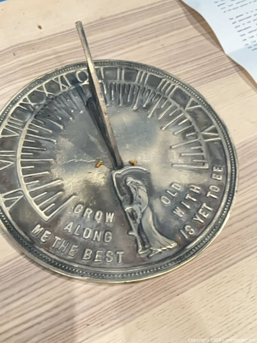 Cast metal sundial with instructions | Maxsold