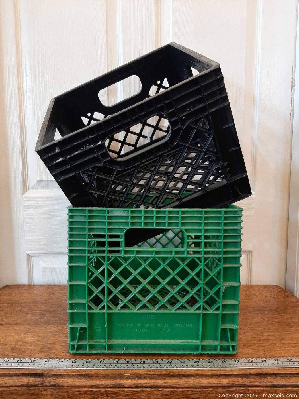 Two stackable plastic milk crates | Maxsold