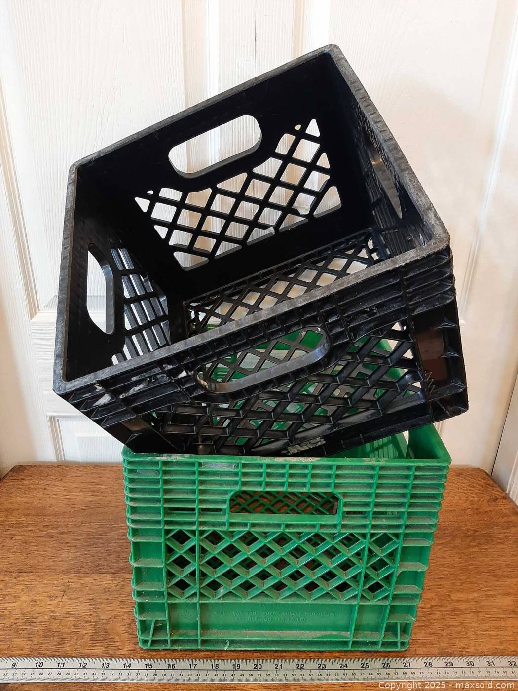 Two stackable plastic milk crates | Maxsold