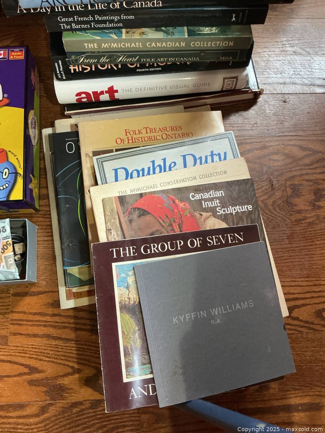 Assorted books, Cranium game, DVDs, Monopoly money | Maxsold