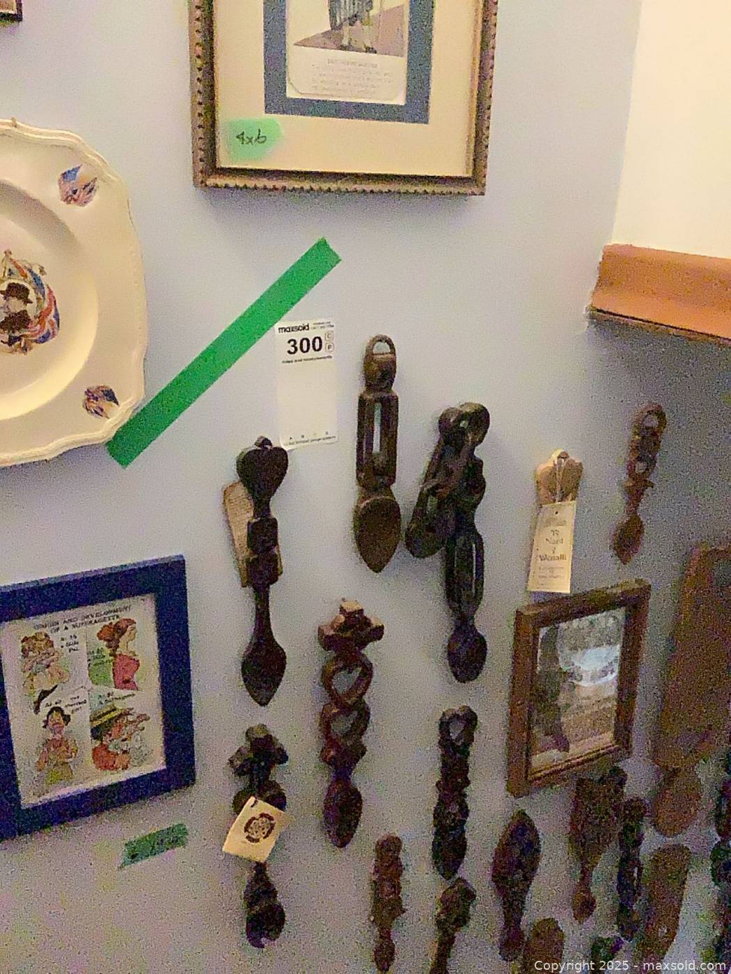Framed prints and carved wooden spoon lot | Maxsold