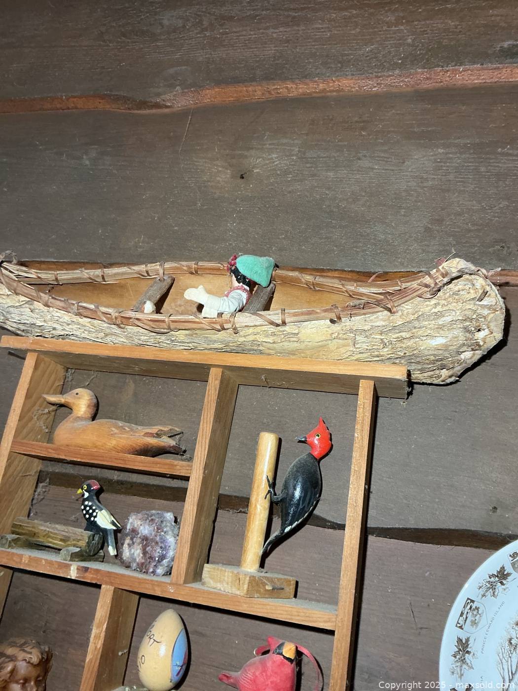 Rustic bark canoe, wall shelf and collectibles | Maxsold
