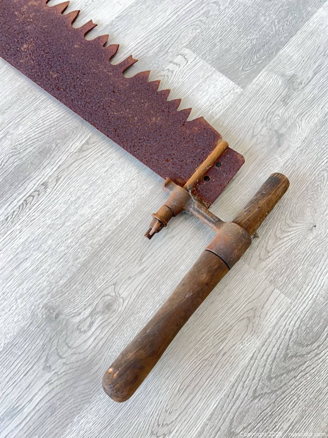 Vintage two-man crosscut logging saw | Maxsold