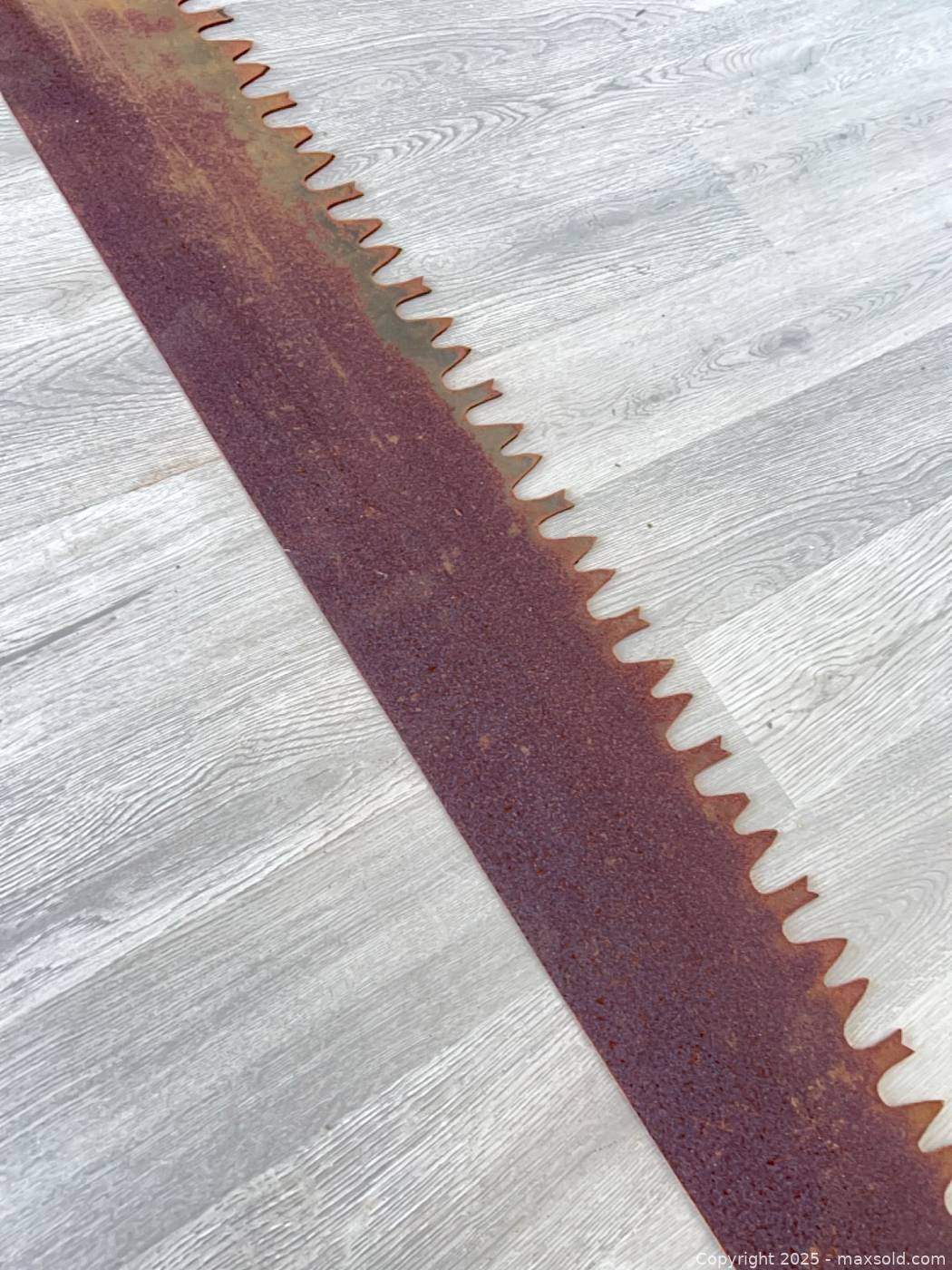 Vintage two-man crosscut logging saw | Maxsold