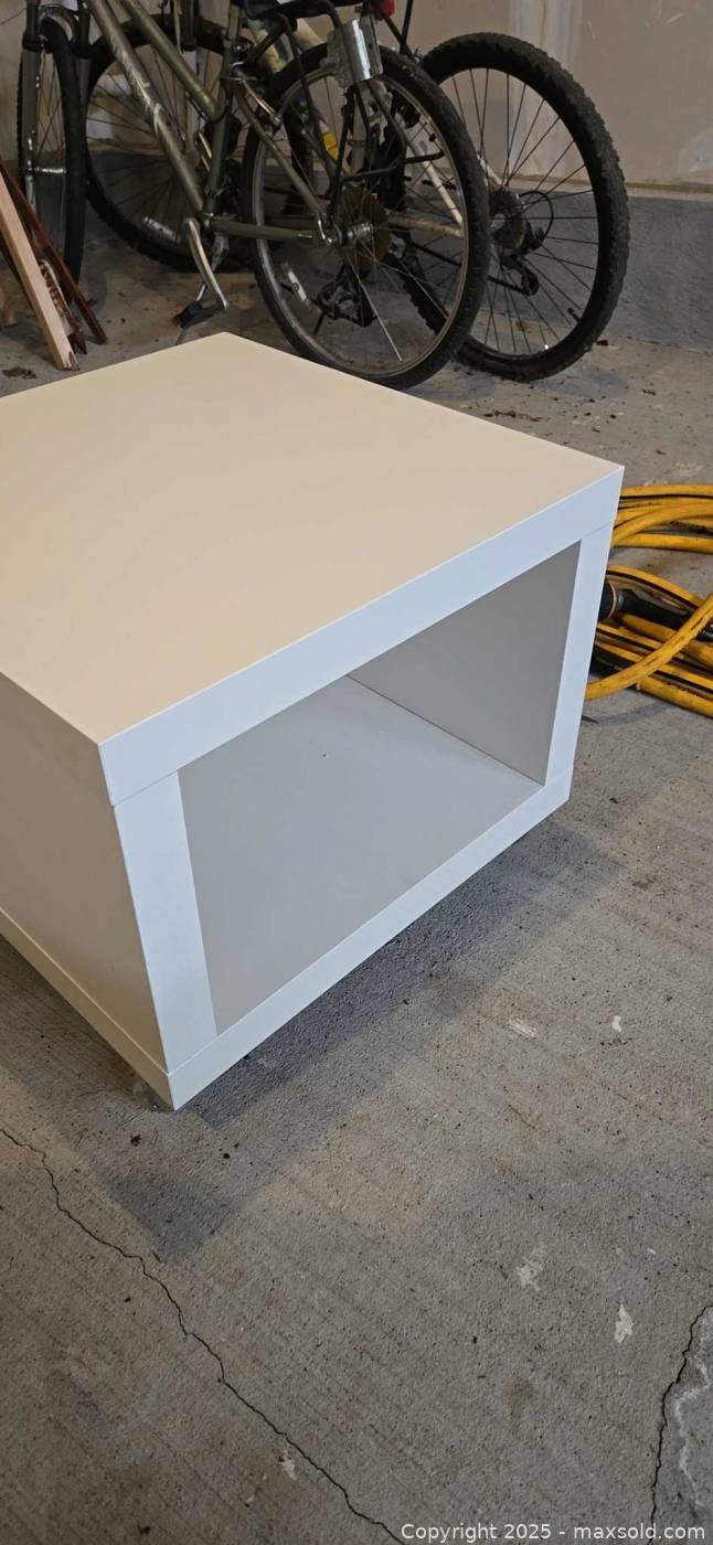 White square side table on casters | Maxsold