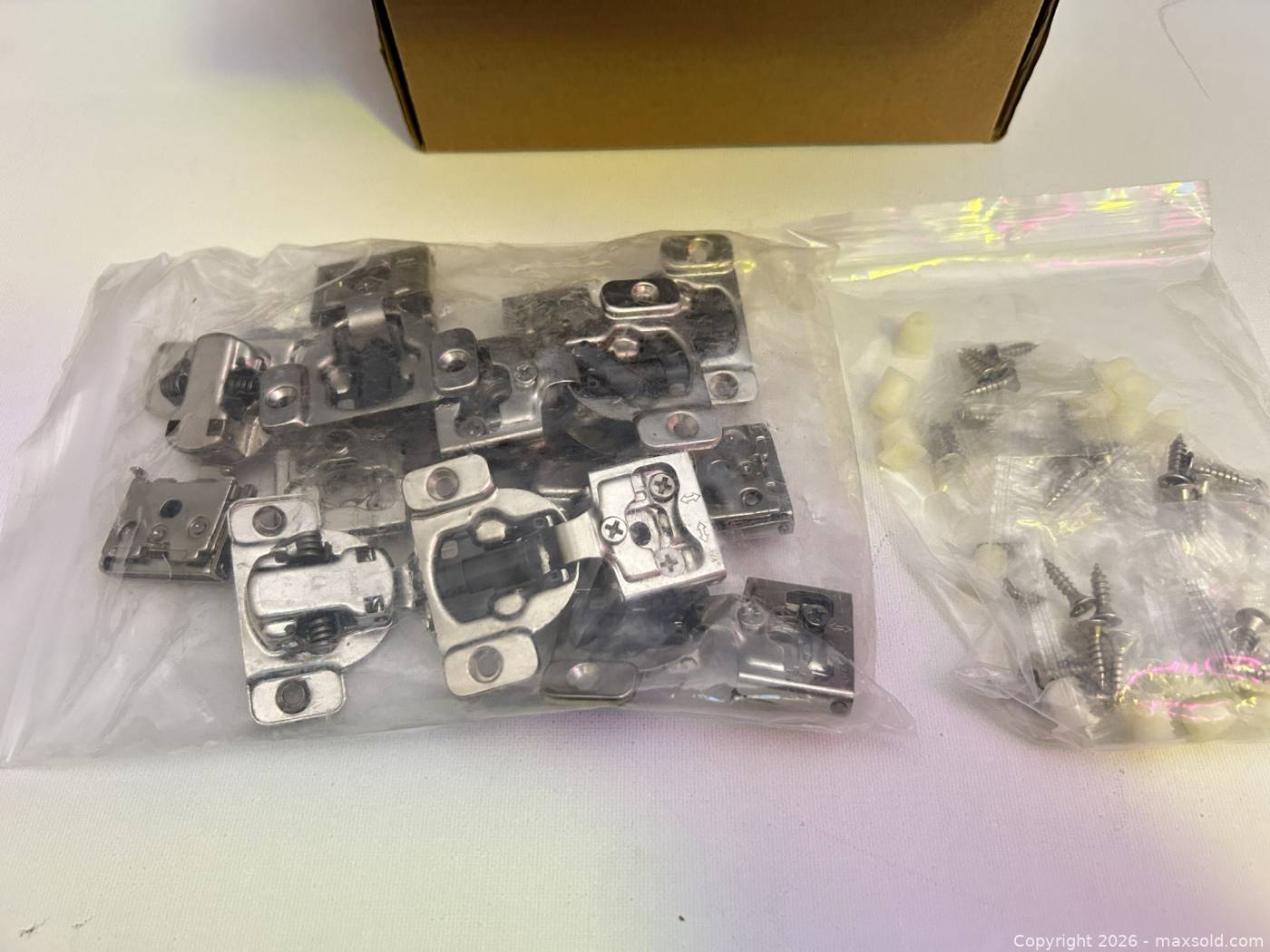 Concealed cabinet hinge mounting plates with screws and caps | Maxsold