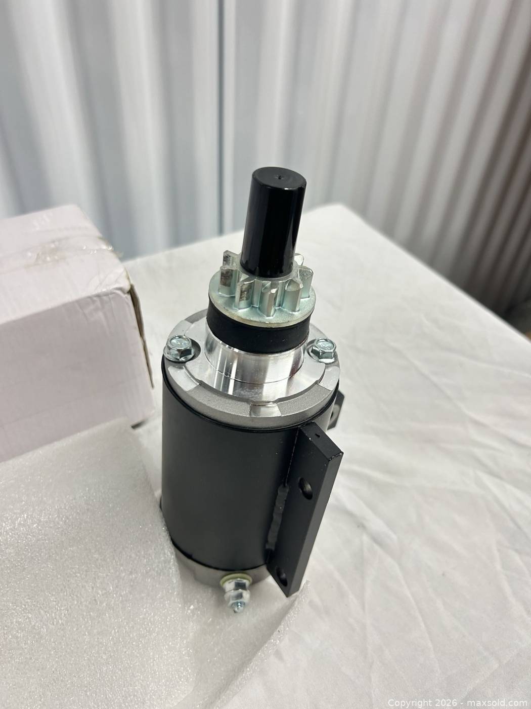 Electric starter motor, likely 12V flange mount | Maxsold