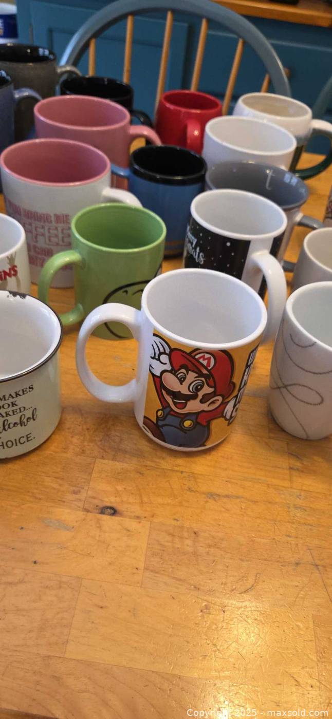 28 assorted ceramic coffee mugs | Maxsold