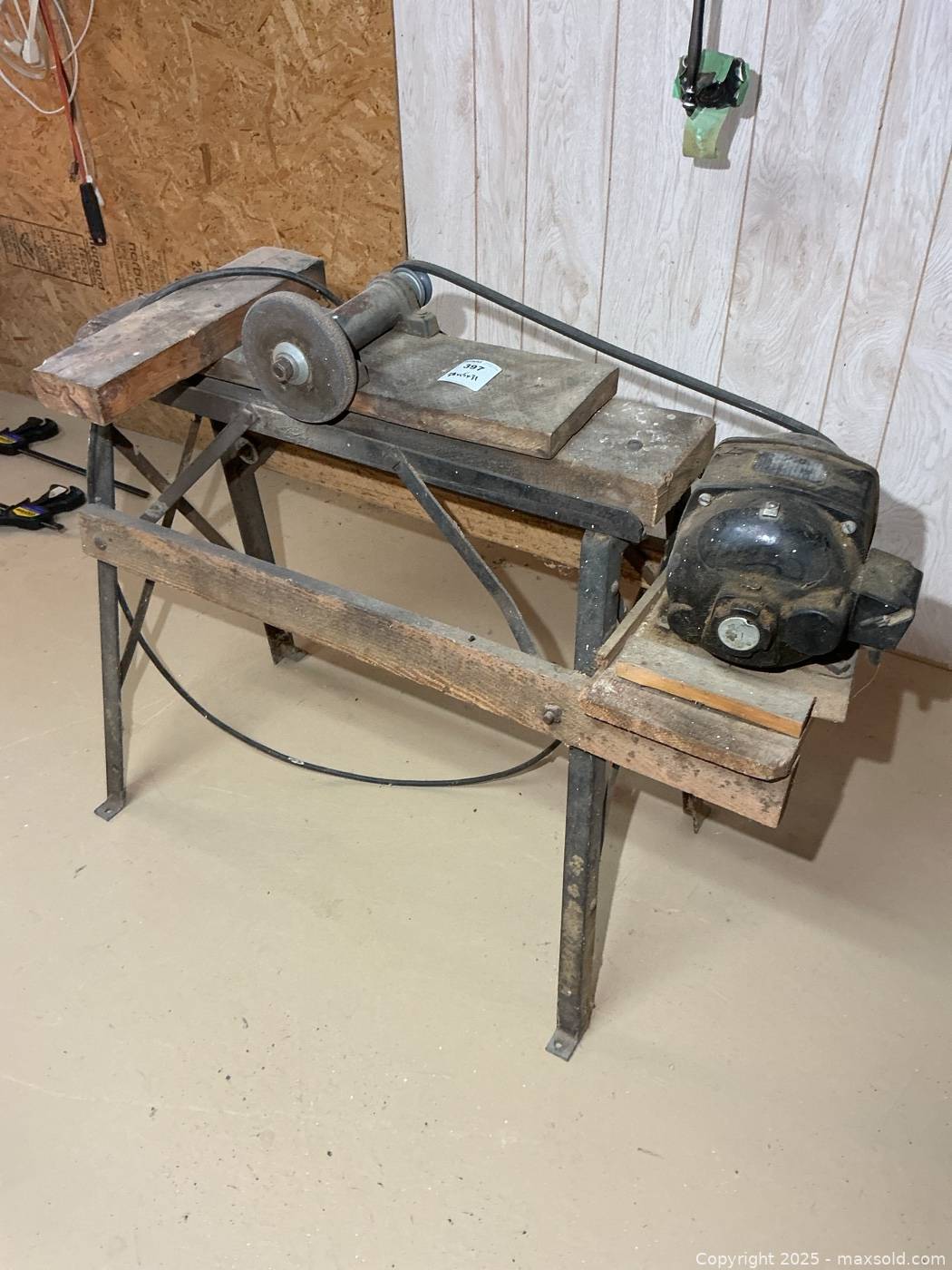 Vintage belt-driven bench grinder on stand | Maxsold