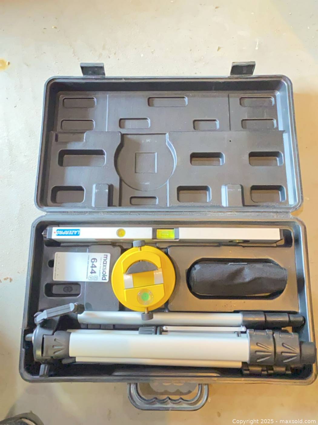 LazerPro laser level kit, tripod, case and Workforce tool bag of assorted hand tools | Maxsold