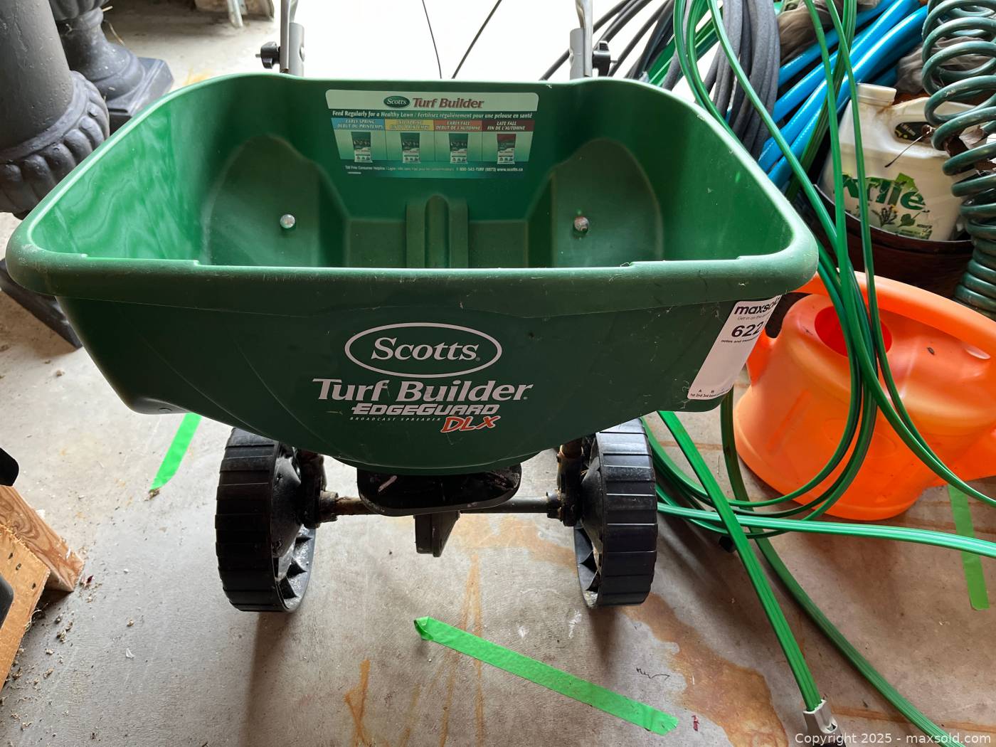 Scotts Turf Builder EdgeGuard DLX spreader, hoses, watering can | Maxsold