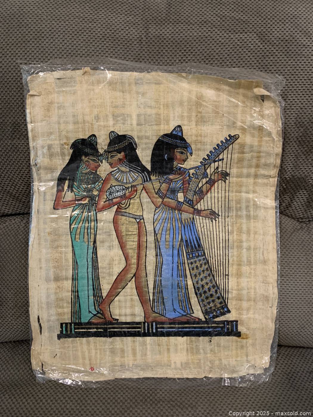Hand-painted papyrus artwork of three Egyptian women musicians | Maxsold