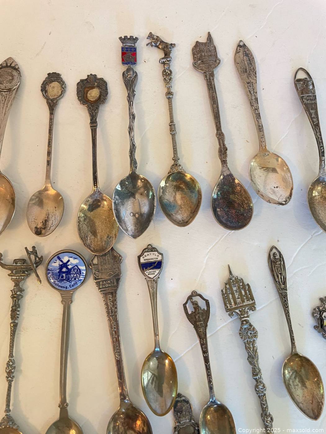 Souvenir Teaspoons, Wall Racks & Carved Fork | Maxsold
