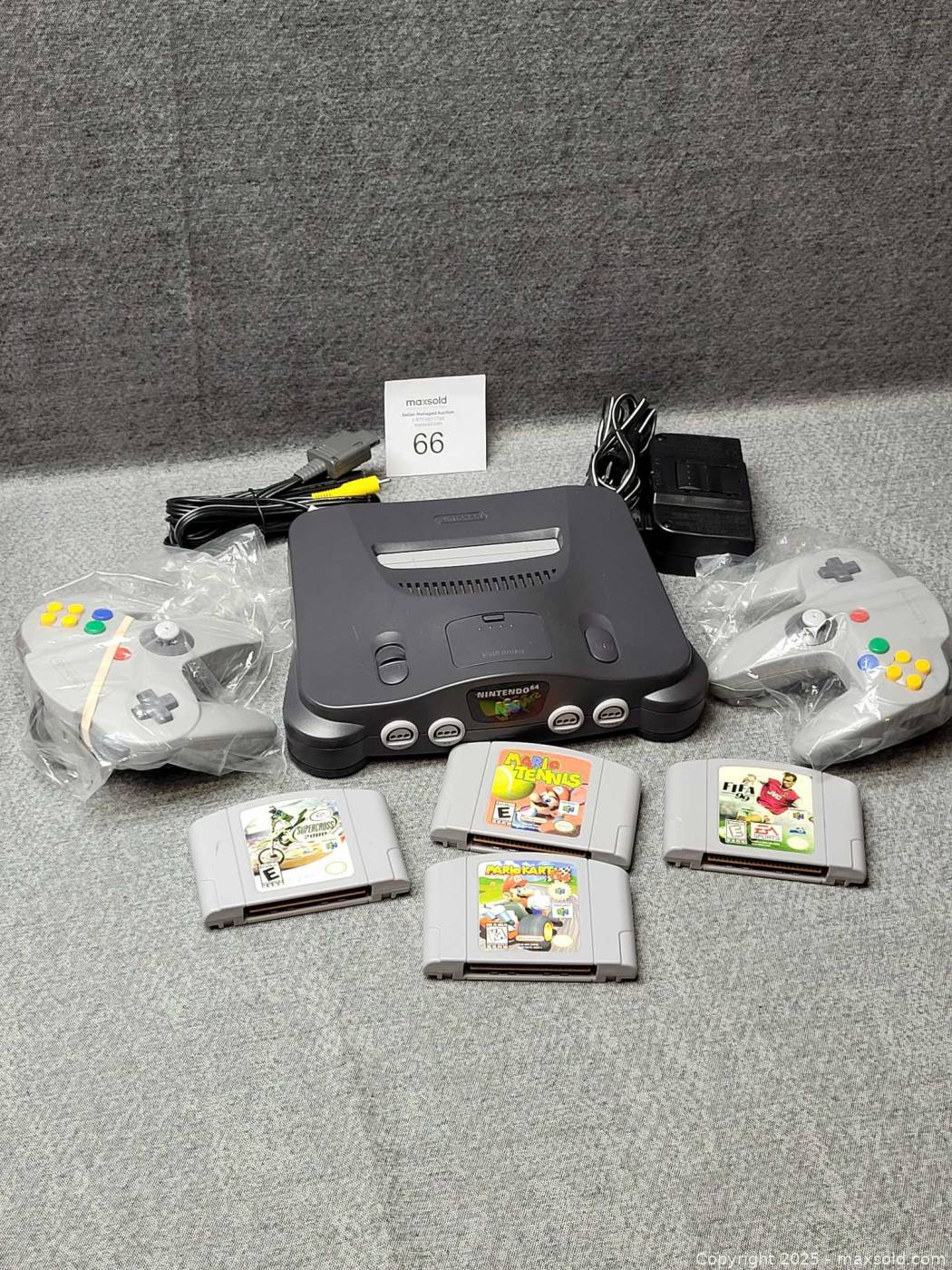 Nintendo 64 system with 2 controllers, 4 games | Maxsold