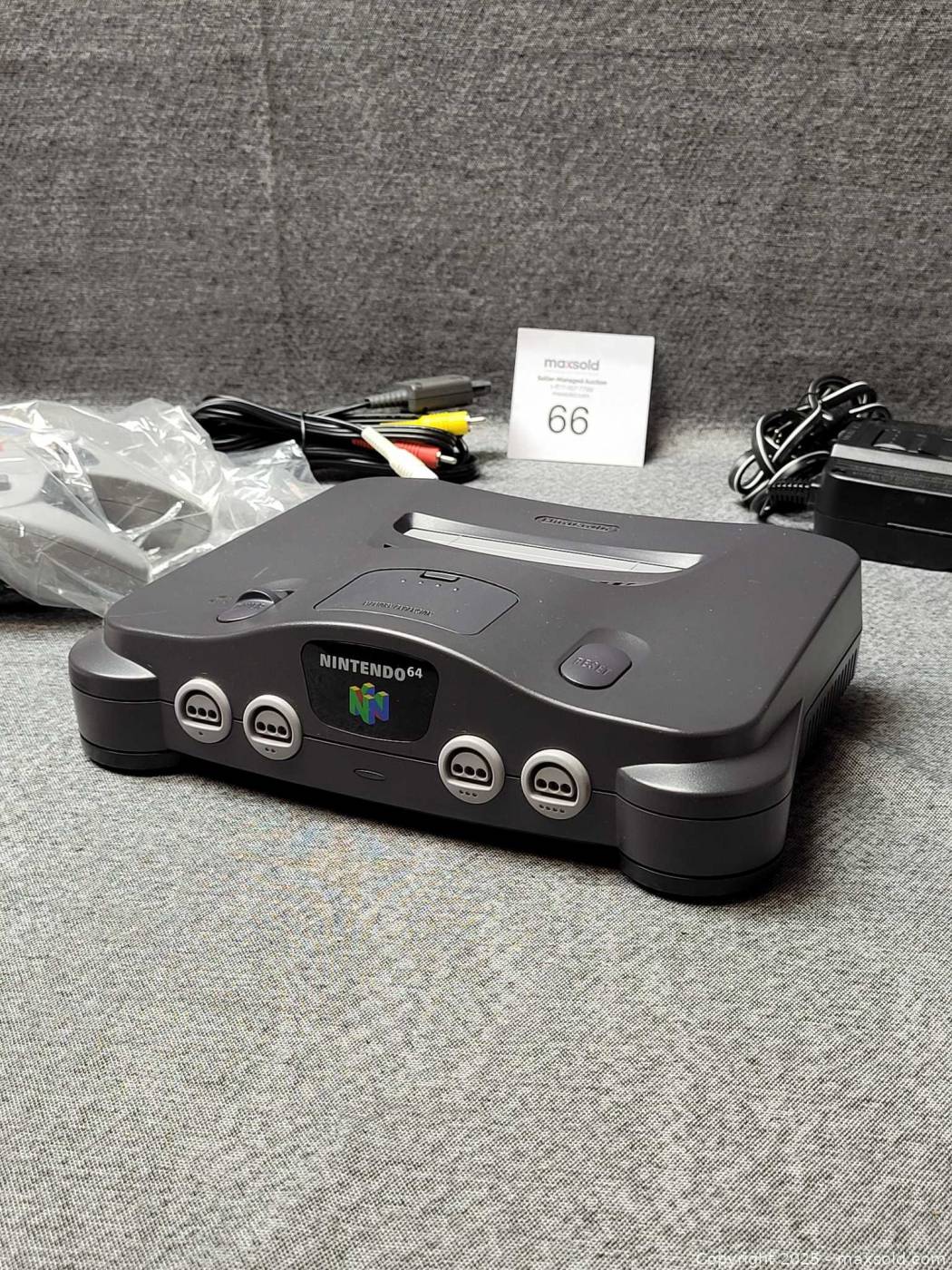 Nintendo 64 system with 2 controllers, 4 games | Maxsold